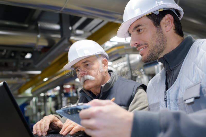 Two Factory Engineers Discussing Stock Photo - Image of male, store ...