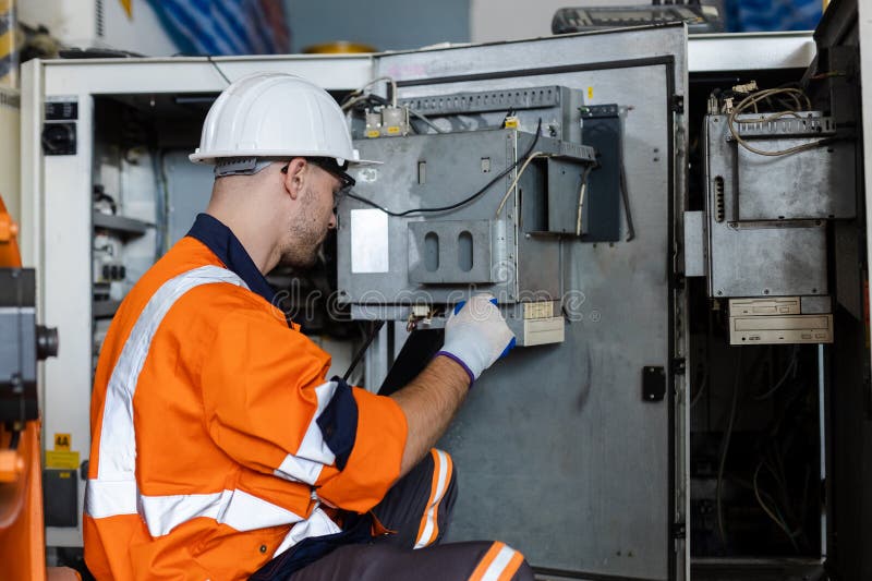Factory Engineers Wear Uniform and Helmet are Checking Quality System ...