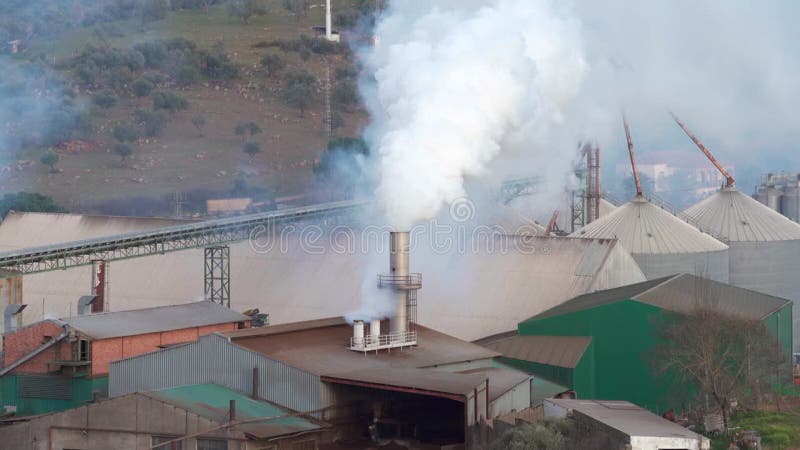 Factory Expelling Pollution and Smoke through a Chimney. Environmental ...