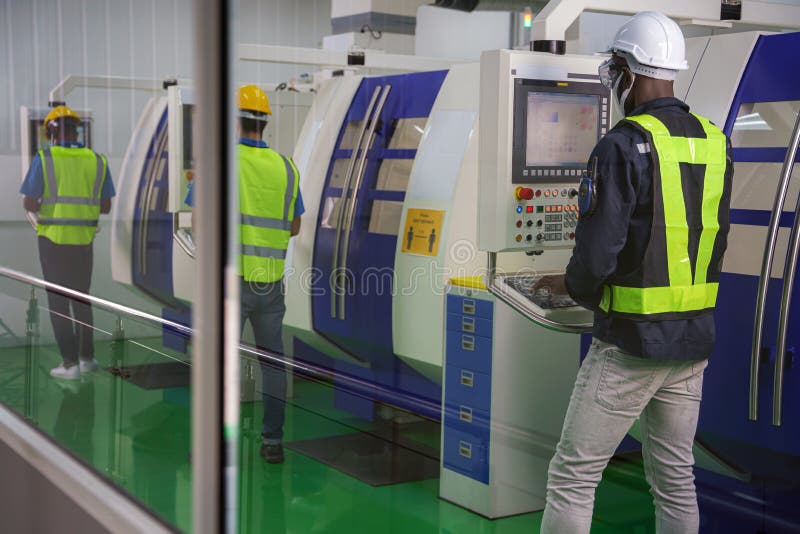 Factory Foreman and Workers Working with Cnc Machine Control Panel ...