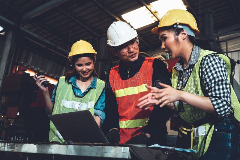 Factory Job Workers Working and Discussing Manufacturing Plan in the ...