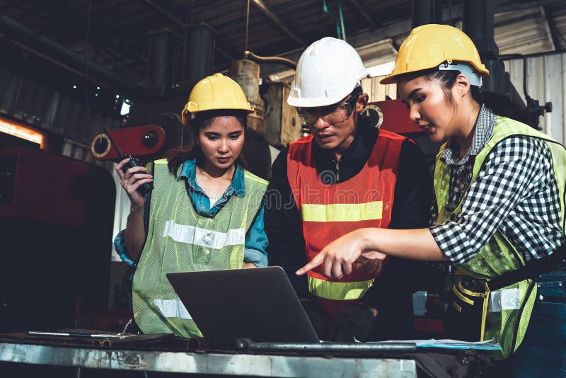 Factory Job Workers Working and Discussing Manufacturing Plan in the ...