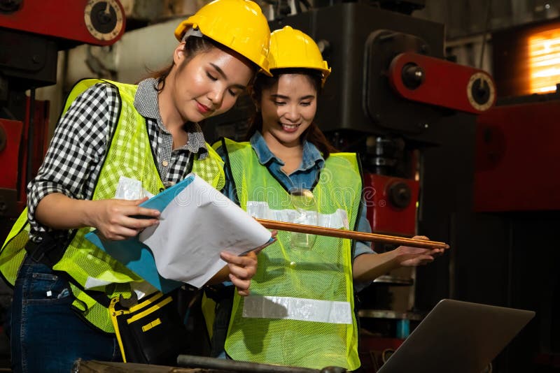 Factory Job Workers Working and Discussing Manufacturing Plan in the ...