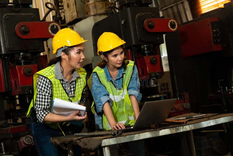 Factory Job Workers Working and Discussing Manufacturing Plan in the ...
