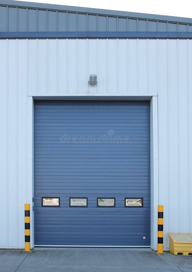 Factory Loading Bay Roller Door on Industrial Building Stock Image ...