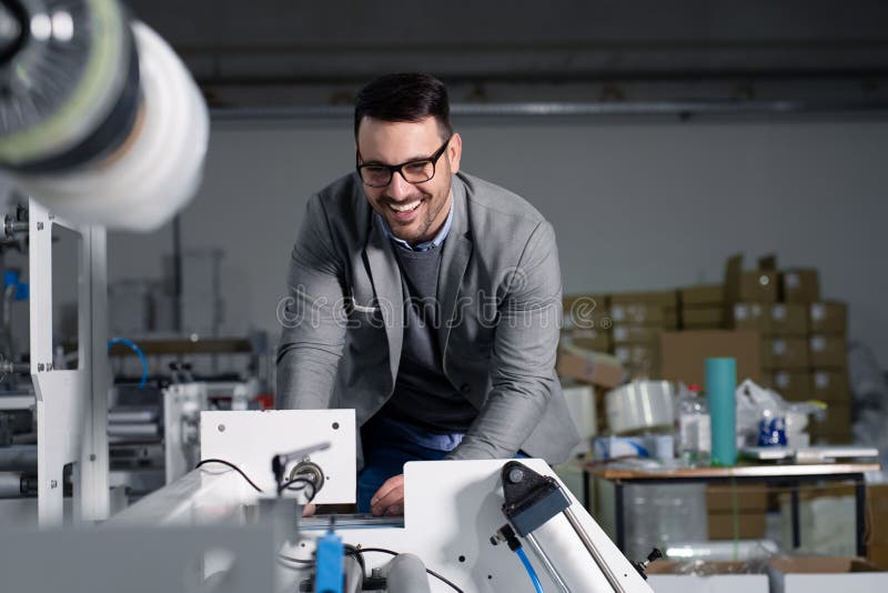 Factory Young Manager in Inspection of Manufacturing. Man in Industrial ...