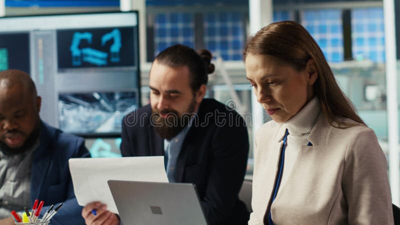 Factory Manager Looking Over Paperwork Files, Developing Business Model ...