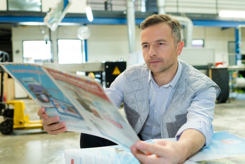 Factory Manager Reading Catalog Stock Photo - Image of people, male ...
