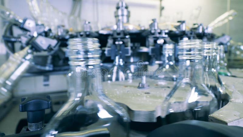Factory Mechanism is Relocating Glass Bottles Stock Footage - Video of ...