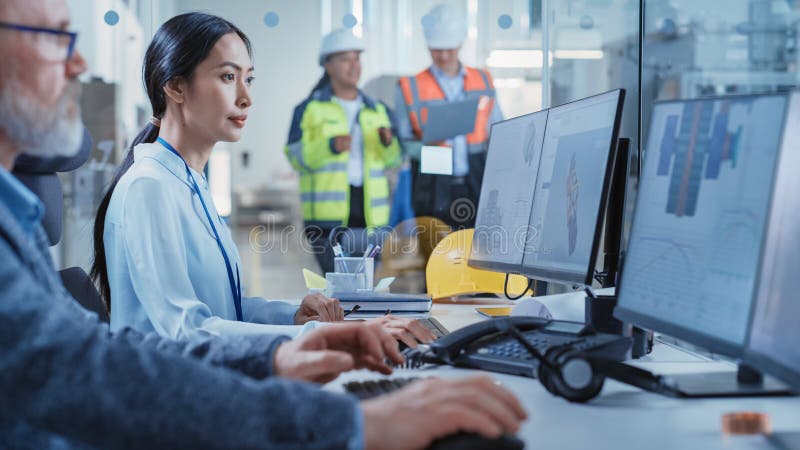 Factory Office Room: Industrial Engineers Developing Models of a Heavy ...