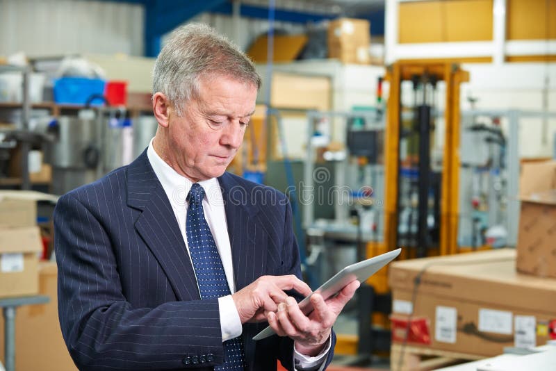 Factory Owner Using Digital Tablet Stock Photo - Image of sixties ...