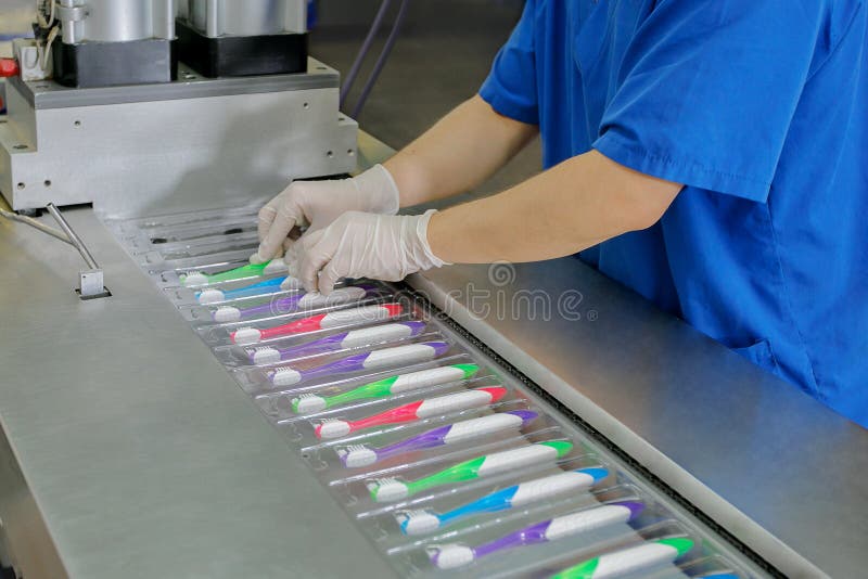 The Factory Produces and Packages Toothbrushes of Different Colors ...