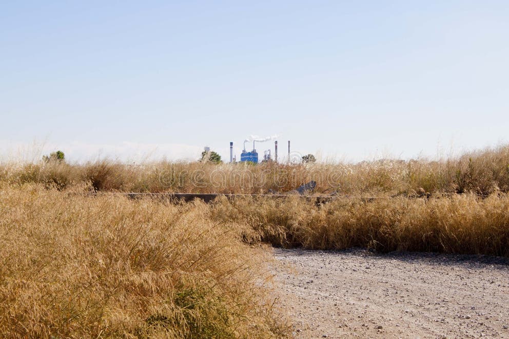 Factory Producing Things in the Middle of a Field Stock Image - Image ...