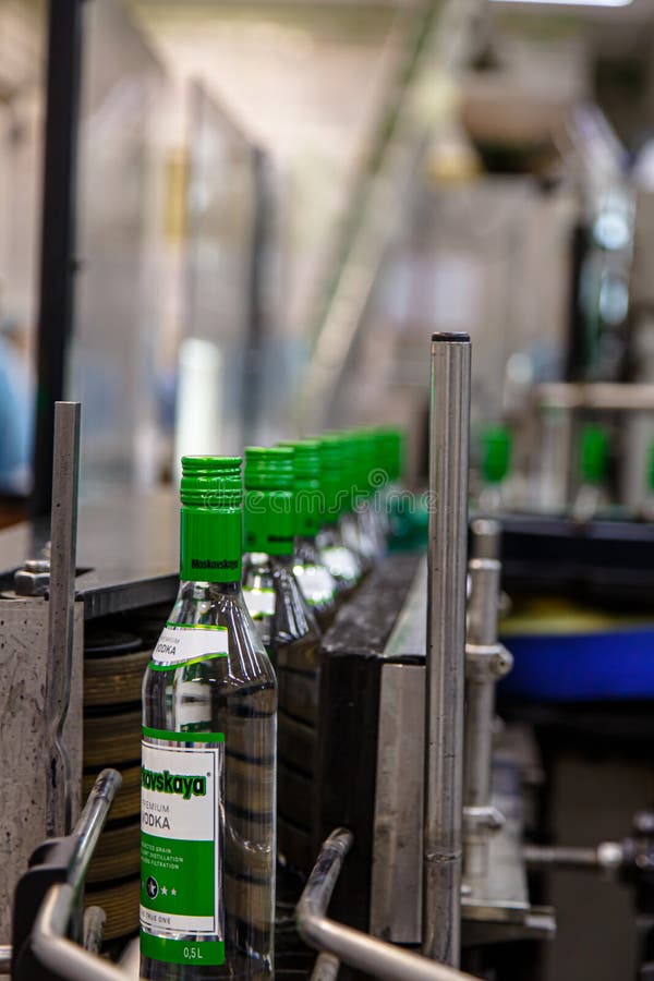Factory for the Production of Alcoholic Beverages. Bottles of Vodka on ...