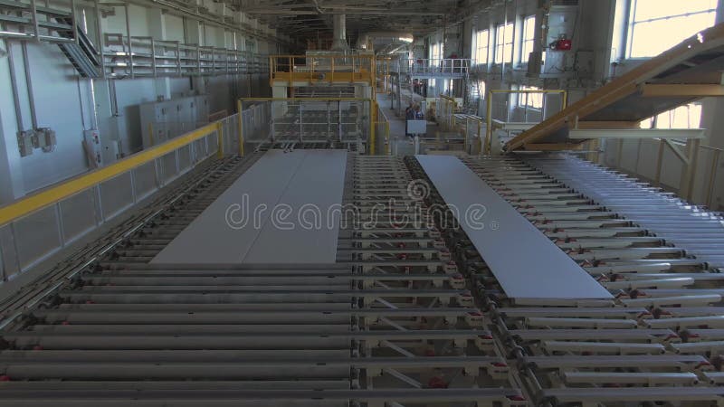 Factory Production Line. a Worker Works in a Factory. Drywall ...