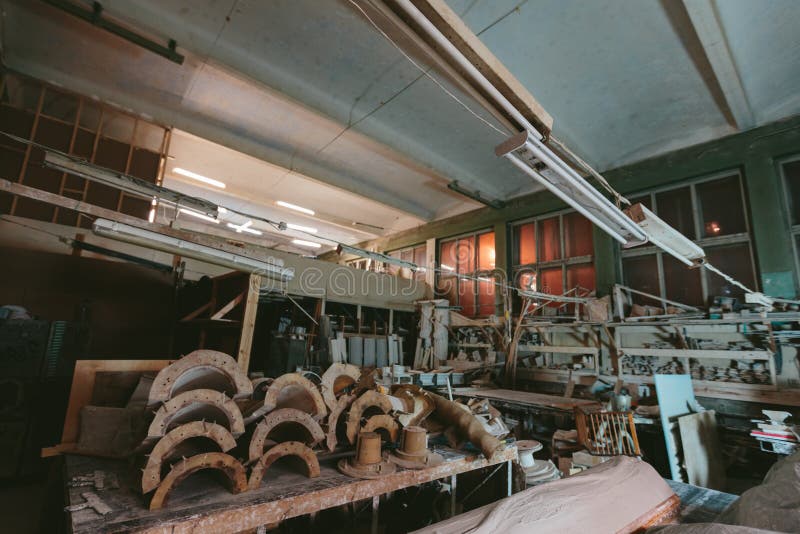 Factory for Production of Plaster Molds. Cluttered Dusty Old Warehouse ...