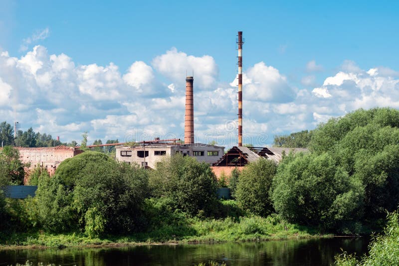 Factory on the river Bank stock photo. Image of dark - 113883604