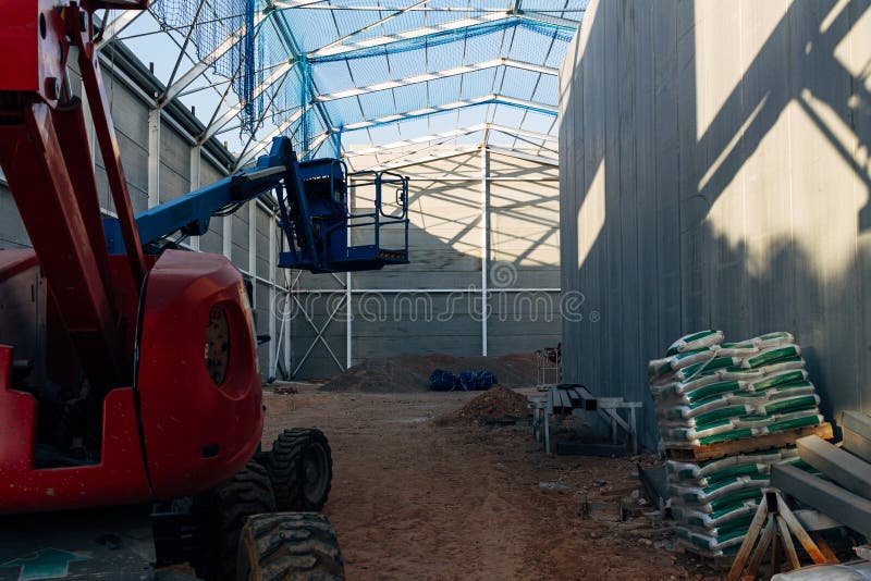 Factory on Site with Crane, Bricks and Building Material Stock Photo ...