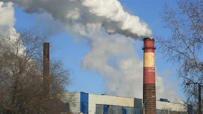 A Factory with Smoke Coming Out of the Chimneys in the Middle of a Lake ...