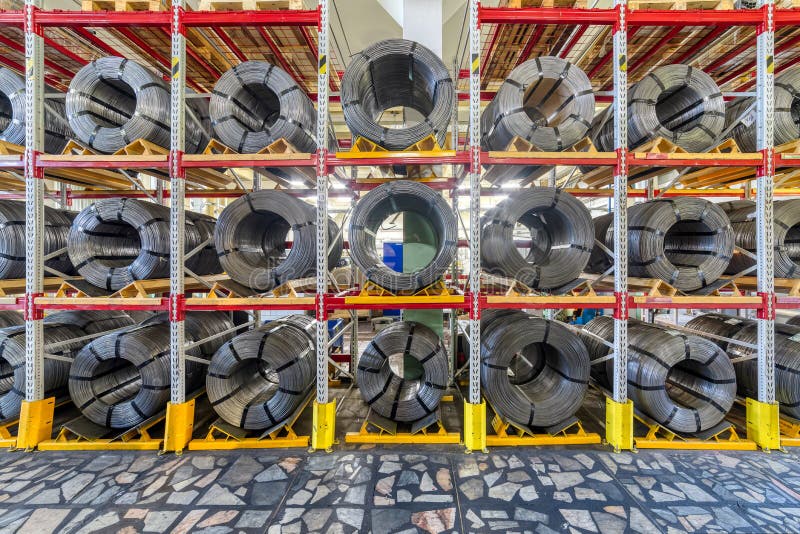 Factory Stock Wire. Wire Spools Lie on Multi-tiered Racks. Stock Photo ...