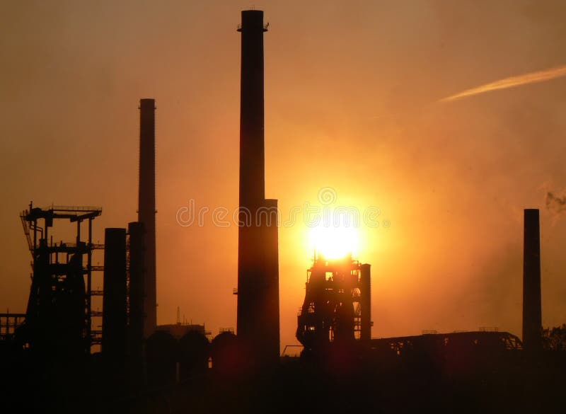 Factory at sunset stock photo. Image of pollution, building - 2596792