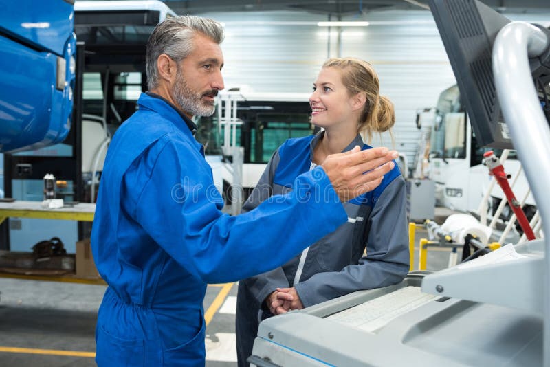 Factory Supervisor Giving Instructions To Female Worker Stock Image ...