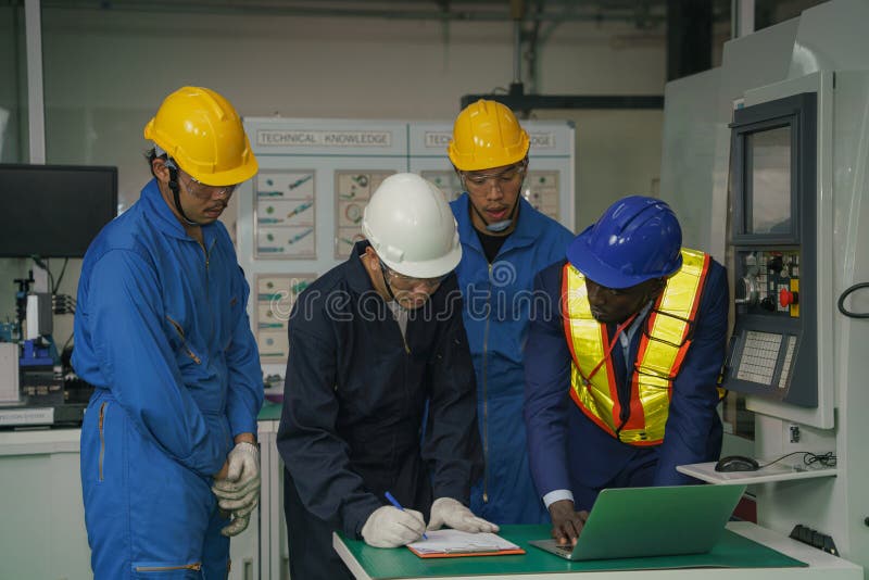 Factory Technician, Foreman and Workers in Technical Discussion Stock ...