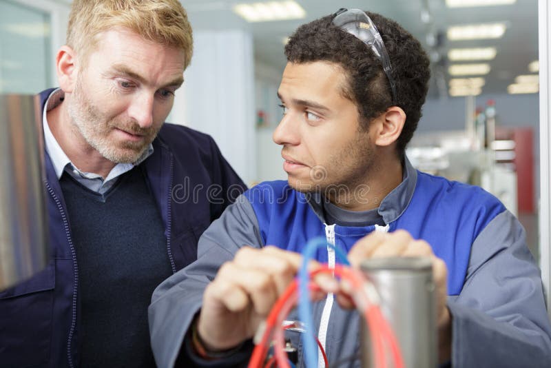 Factory Technician and Trainer Stock Photo - Image of male, factory ...