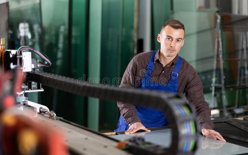 Factory Technician Processing Glass Sheet on Cutting Machine Stock ...
