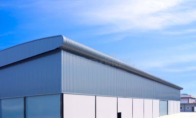 Factory Warehouse Building with Automatic Shutter Doors on Concrete and ...