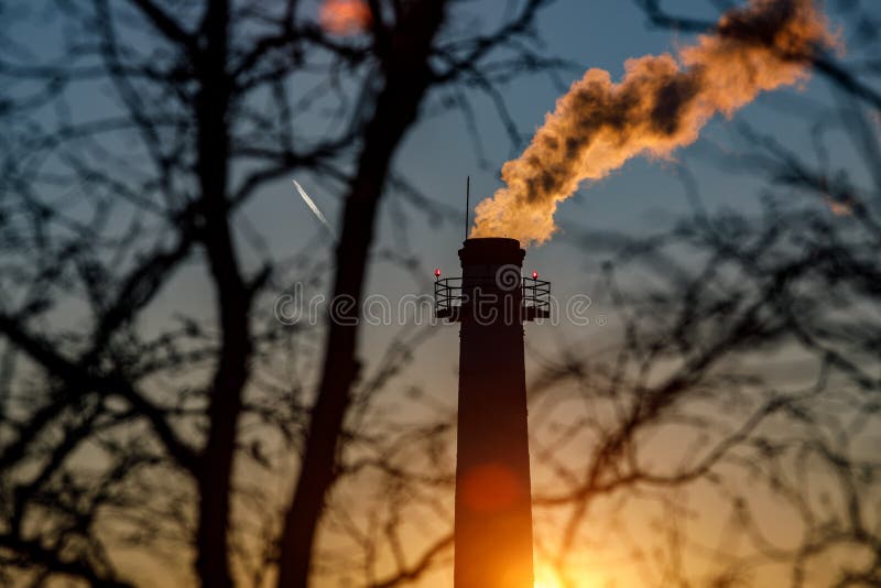 Factory Work, Chimney with Smoke, View through Tree Branches, Sunset ...