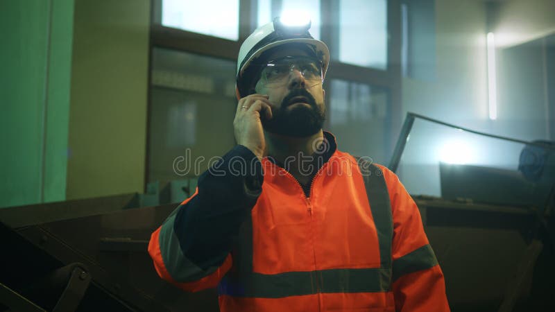 Factory Worker Answering Phone Call in Workshop Stock Photo - Image of ...