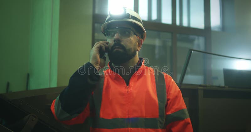 Factory Worker Speaking on Smartphone Near Conveyor Belt Stock Video ...