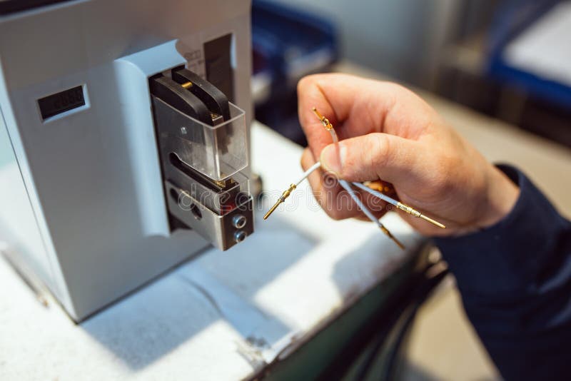 Factory Worker Assembles Cable Connections Using a Special Machine ...