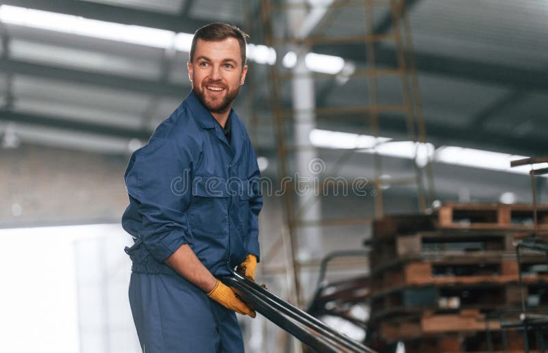 Factory Worker in Blue Uniform is Indoors Stock Photo - Image of human ...