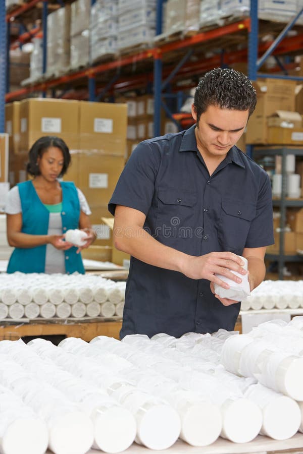 Factory Worker Checking Goods on Production Line Stock Photo - Image of ...