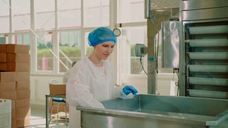 Factory Worker Checking Packing Machine. Candy Factory. Stock Image ...