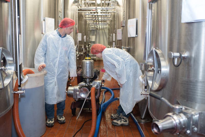 Factory Worker Cleaning Floor Stock Image - Image of colleagues ...