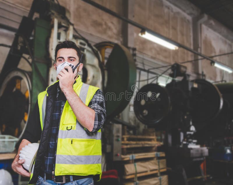 A Factory Worker Holds a Hard Hat and Talks a Radio Stock Photo - Image ...