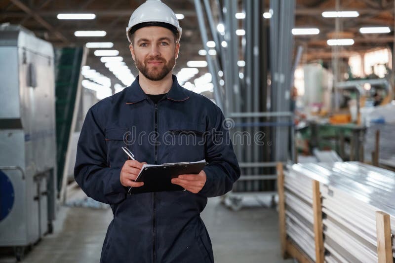 Factory Worker is Indoors with Hard Hat Stock Photo - Image of ...