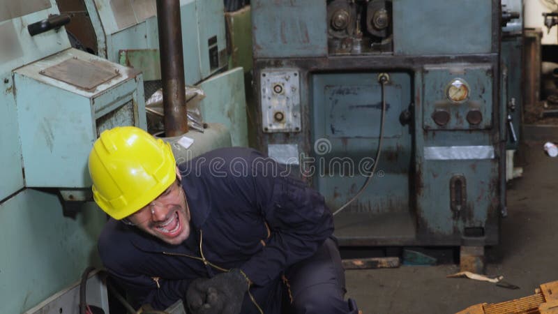 Factory Worker Injured by Accident while Using Machine in Factory Stock ...
