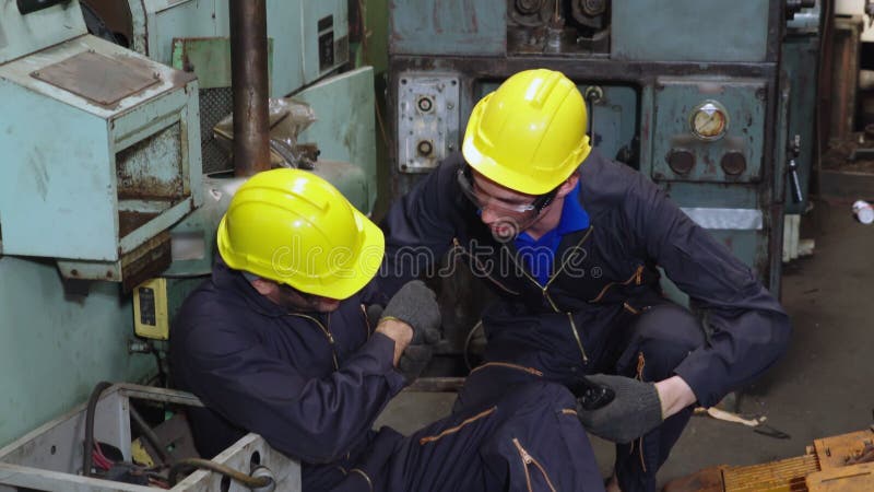 Factory Worker Injured by Accident while Using Machine in Factory Stock ...