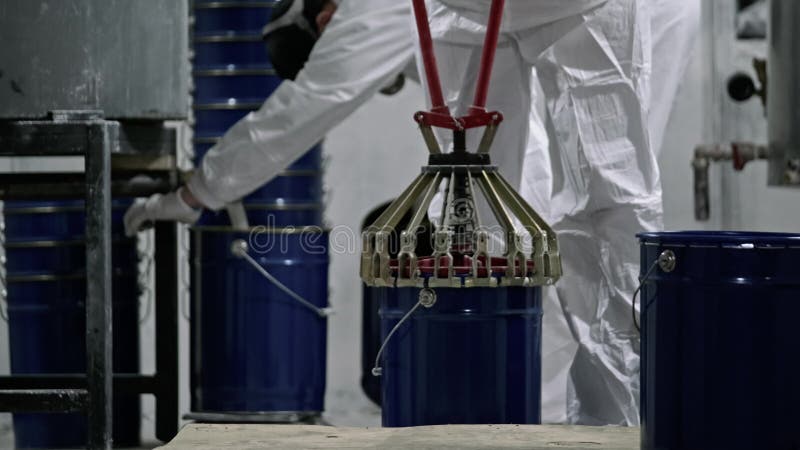 Factory Worker Lifting Paint Bucket Using Machine Stock Footage - Video ...