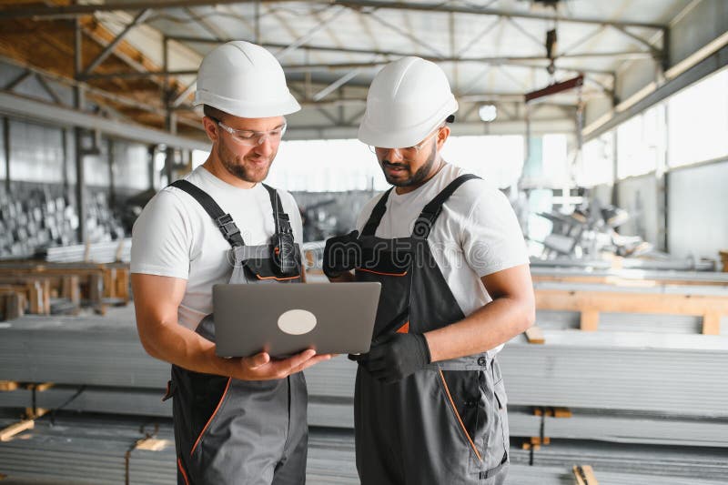 Factory Worker Man and Engineer Manager Working Together a Metal Sheet ...