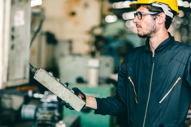 Factory Worker Man Intend To Operate the Machine, High Skill Labor Work ...