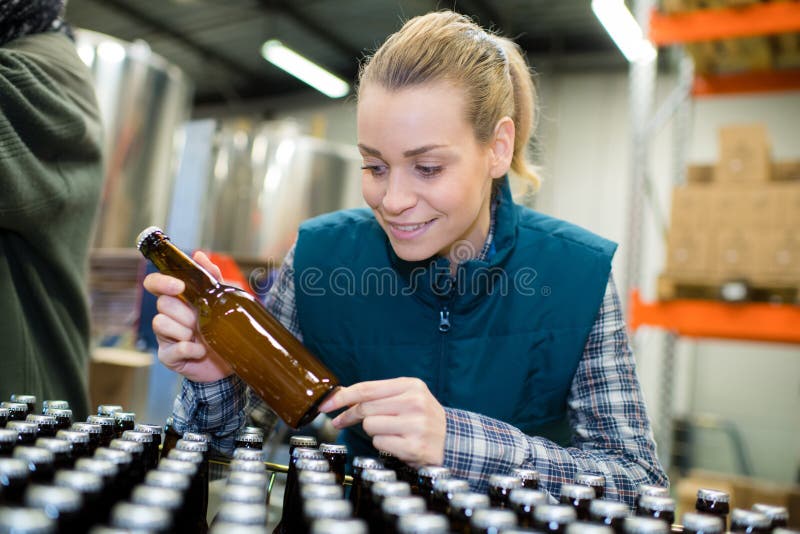 Factory Worker Operating Conveyor with Beer Bottles Stock Photo - Image ...