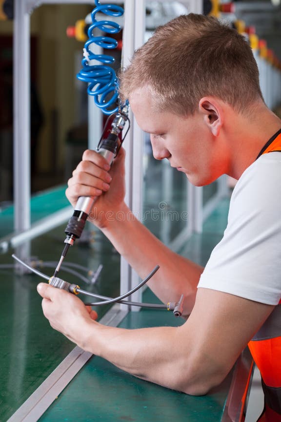 Factory Worker with Pneumatic Screwdriver Stock Photo - Image of ...