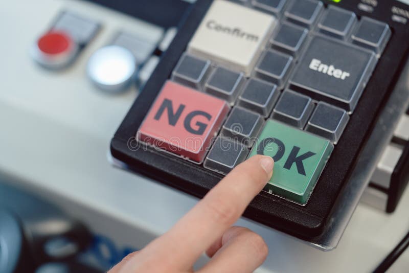 Factory Worker Pressing the OK Button on a Machine Stock Photo - Image ...