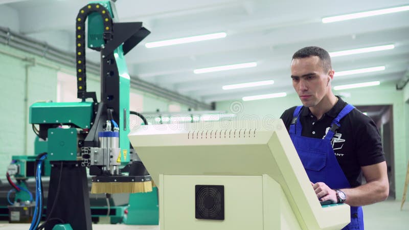 A Male Factory Worker is Standing at the Monitor. Stock Footage - Video ...