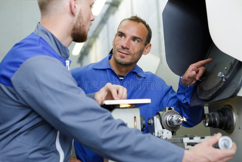 Factory Worker Standing with Machine Stock Photo - Image of automated ...